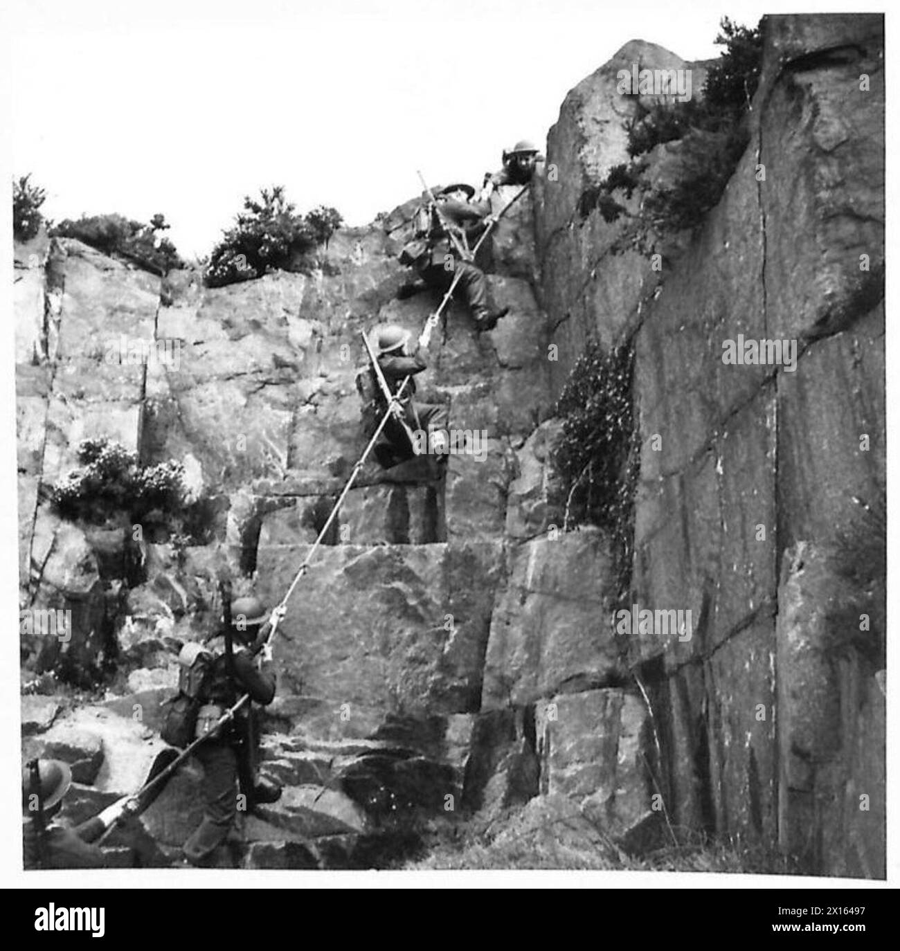 LANCASHIRE LADS TOUGHEN-UP - Scaling the cliff-face. Its tough going ...