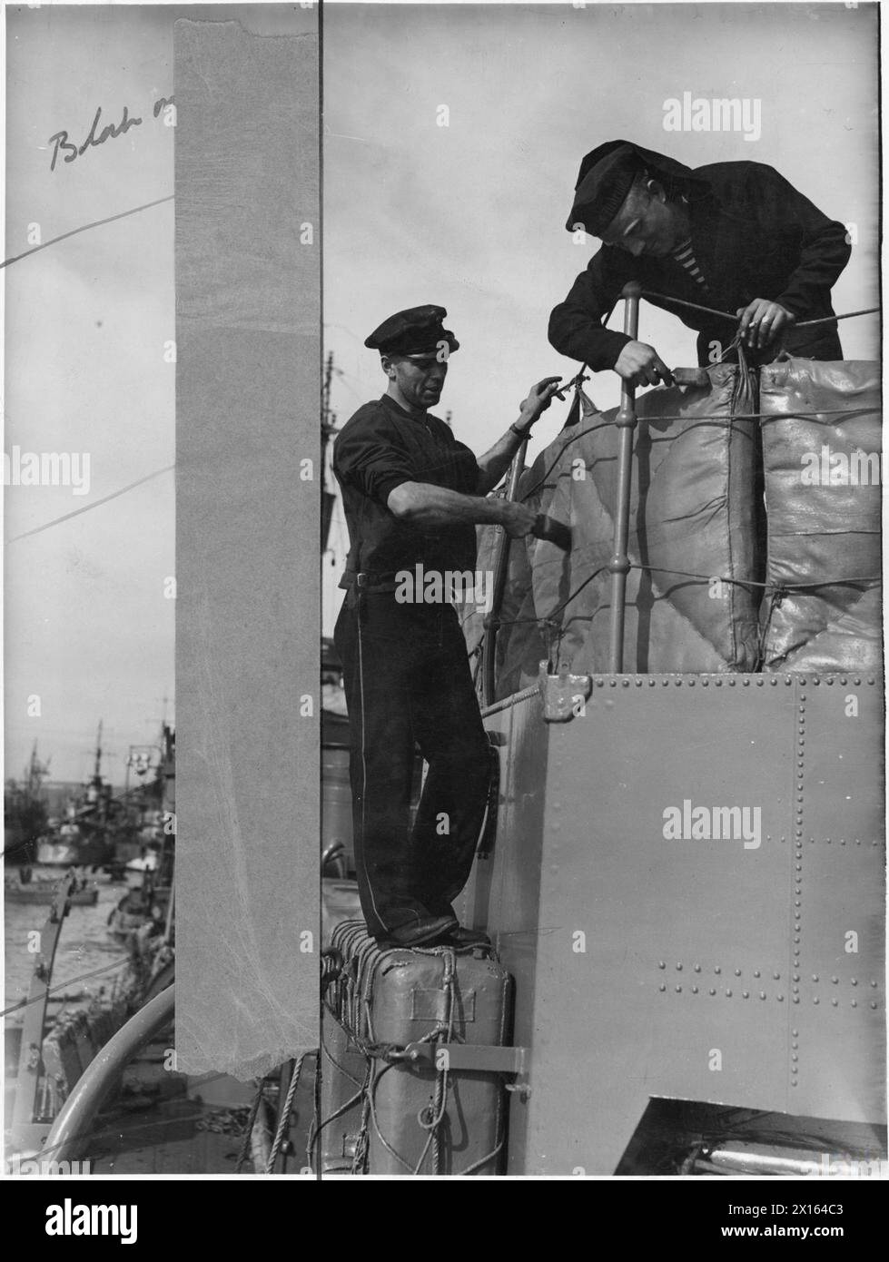 Crew members of a Dutch destroyer in the Royal Netherlands Navy paint ...