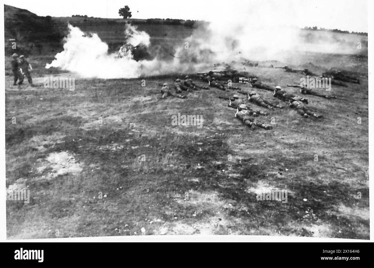 An anti-tank platoon attacks a target tank with rifle fire after ...