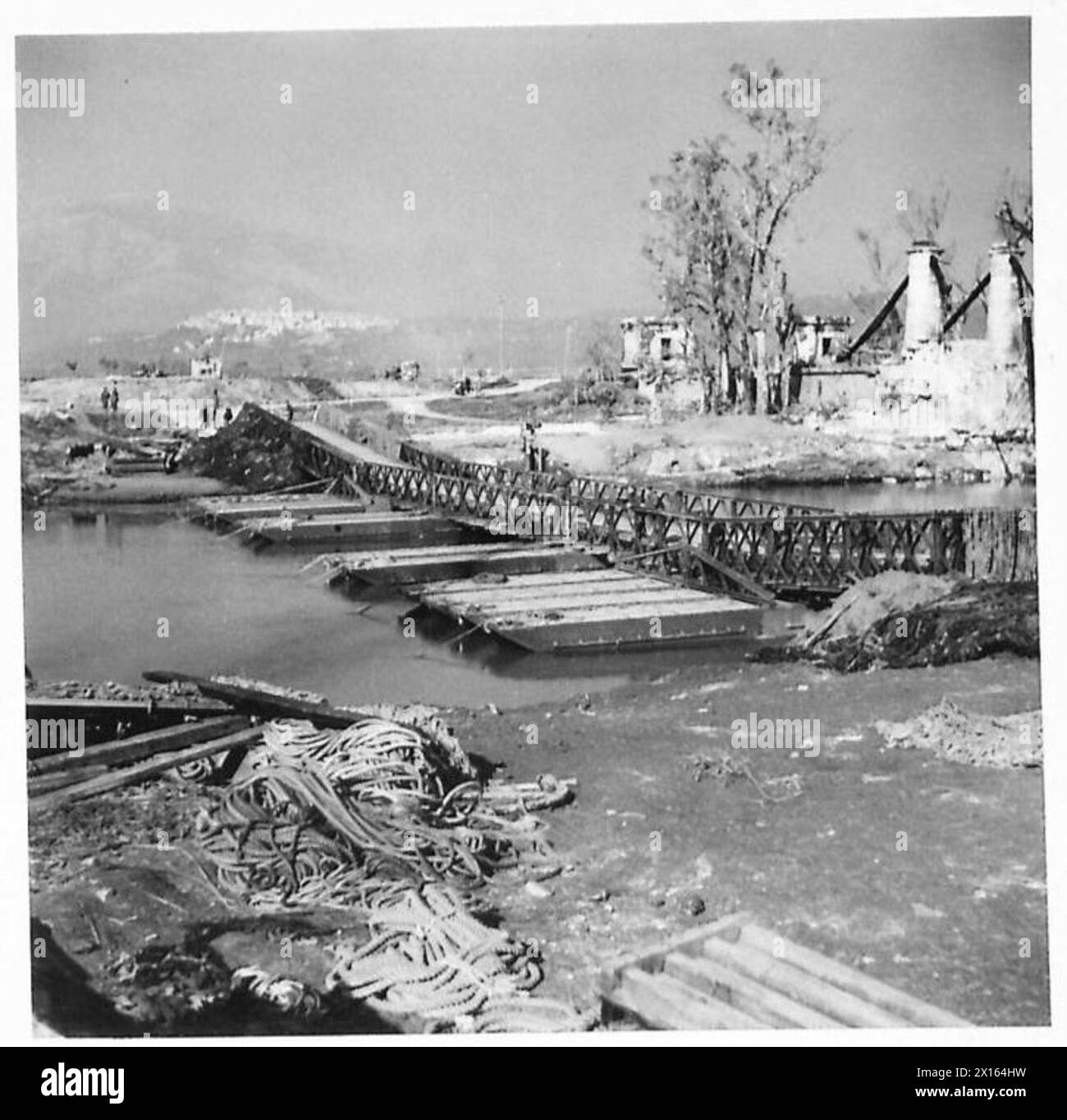 A pontoon bridge is constructed across the Garigliano River beside the ...