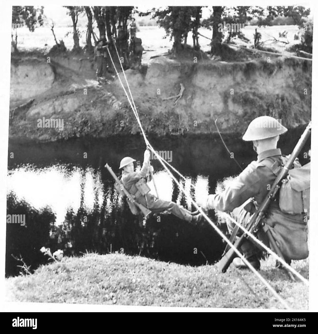 GETTING ACROSS A RIVER - A pick axe suspended from the pulley makes a ...