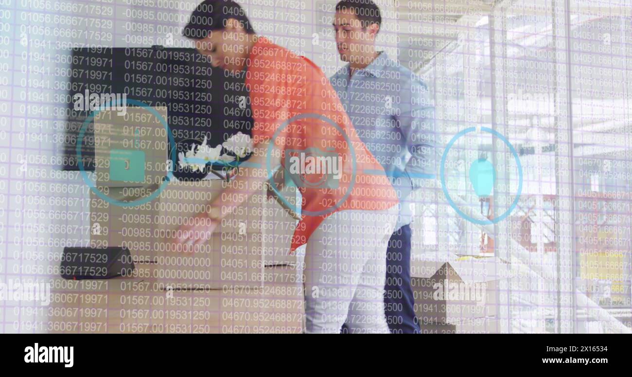 A view of two people working in a modern office, moving in and ...