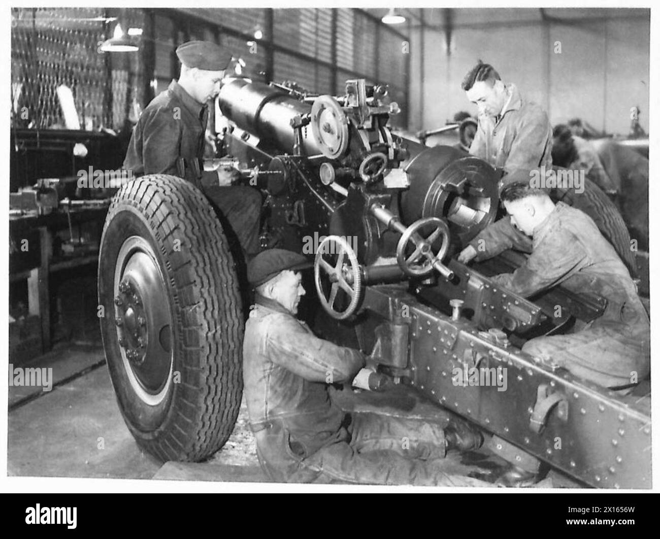 SOLDIERS AND CIVILIANS REPAIR ARMY EQUIPMENT - Army and civilian ...