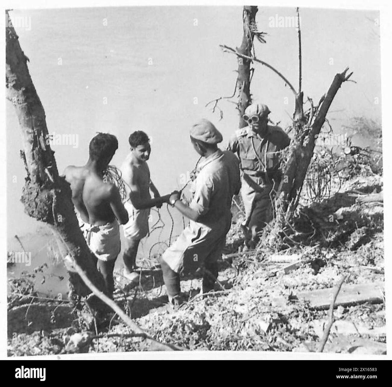 Two Indian soldiers of the British Eighth Army swim across the River ...