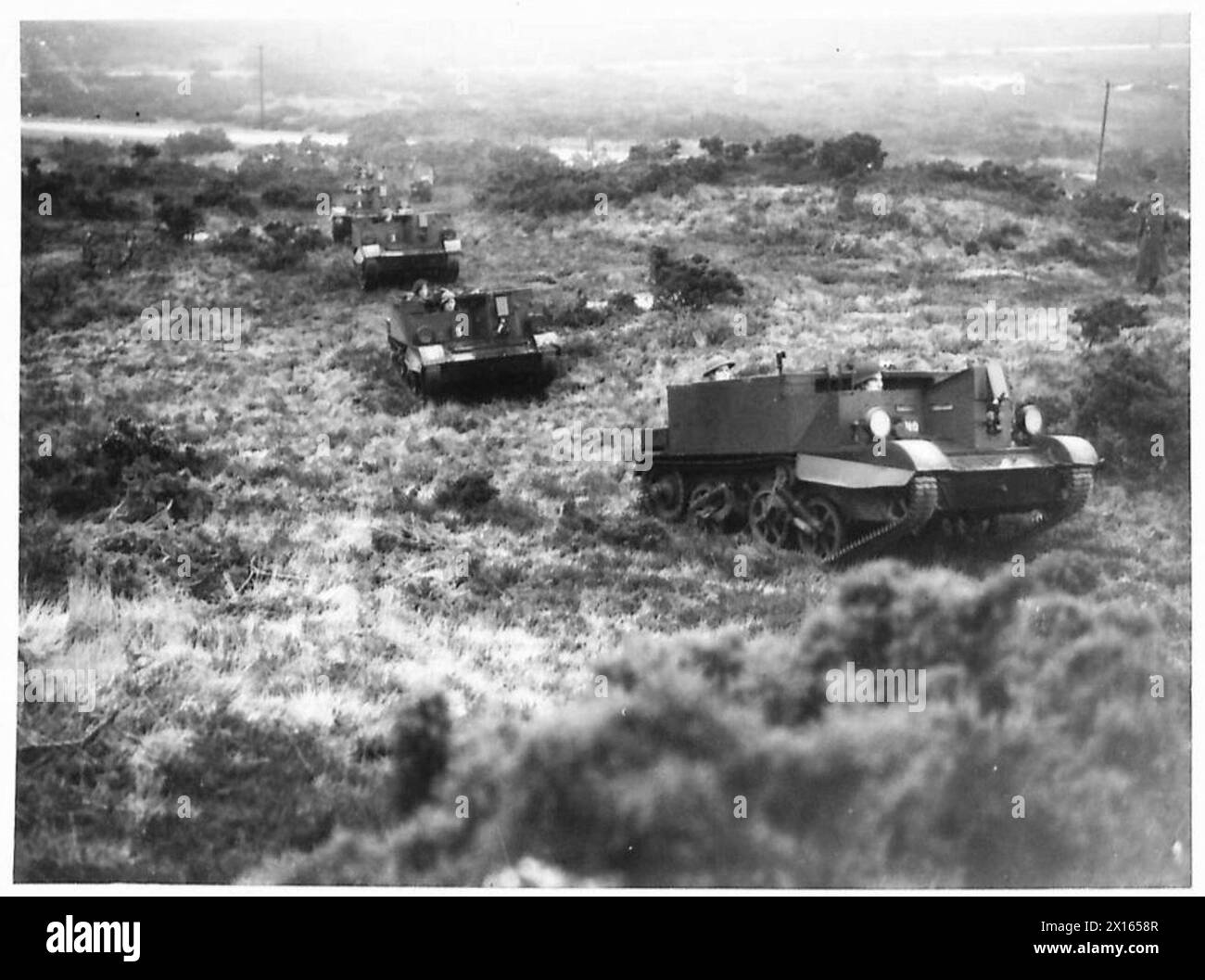 EAST YORKS IN TRAINING - Bren carriers going into action over rough ...