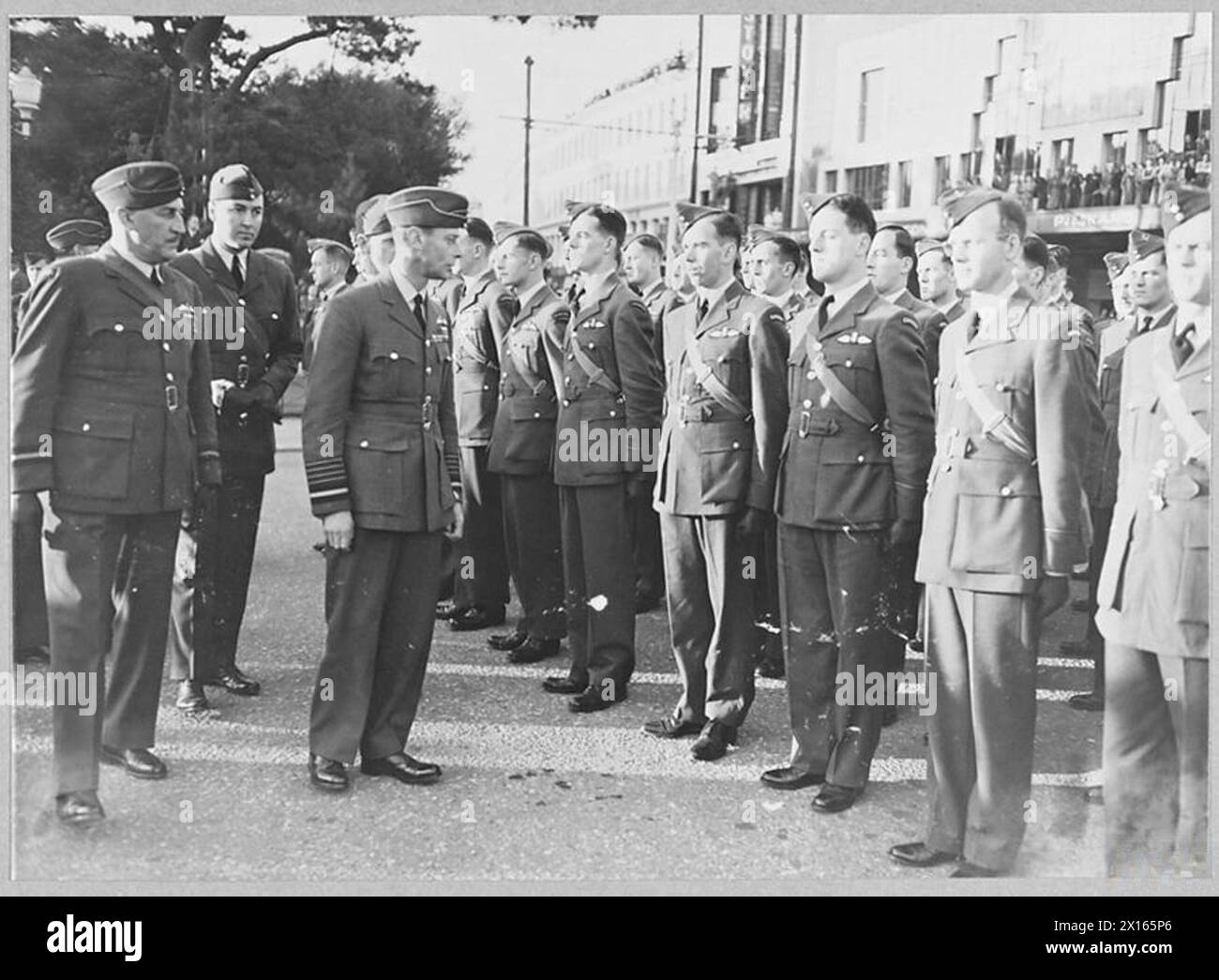 The King inspects Canadian airmen as part of a ceremonial review ...