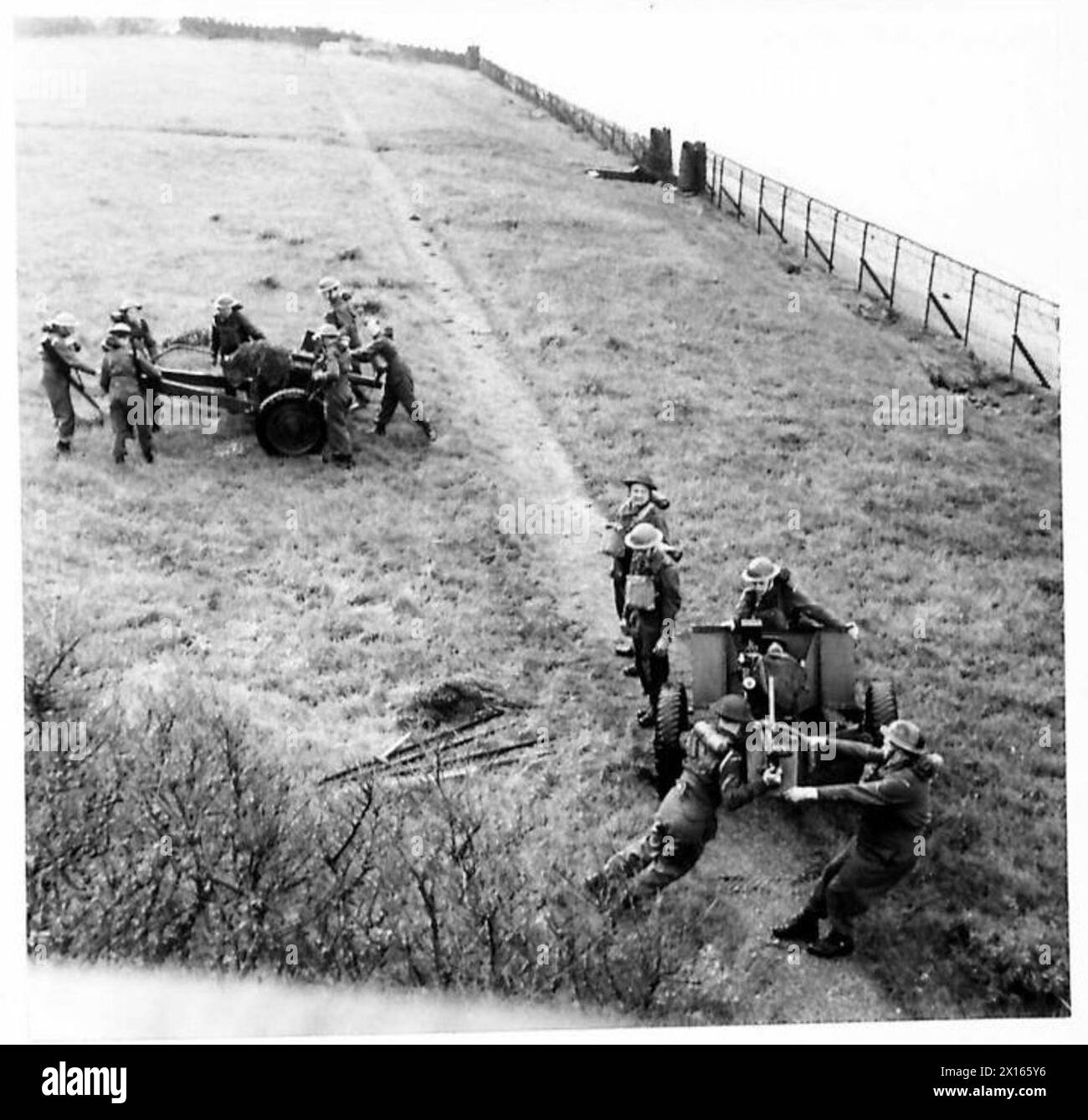 Home Guard gun crews maneuver 6-pounder naval guns into firing ...