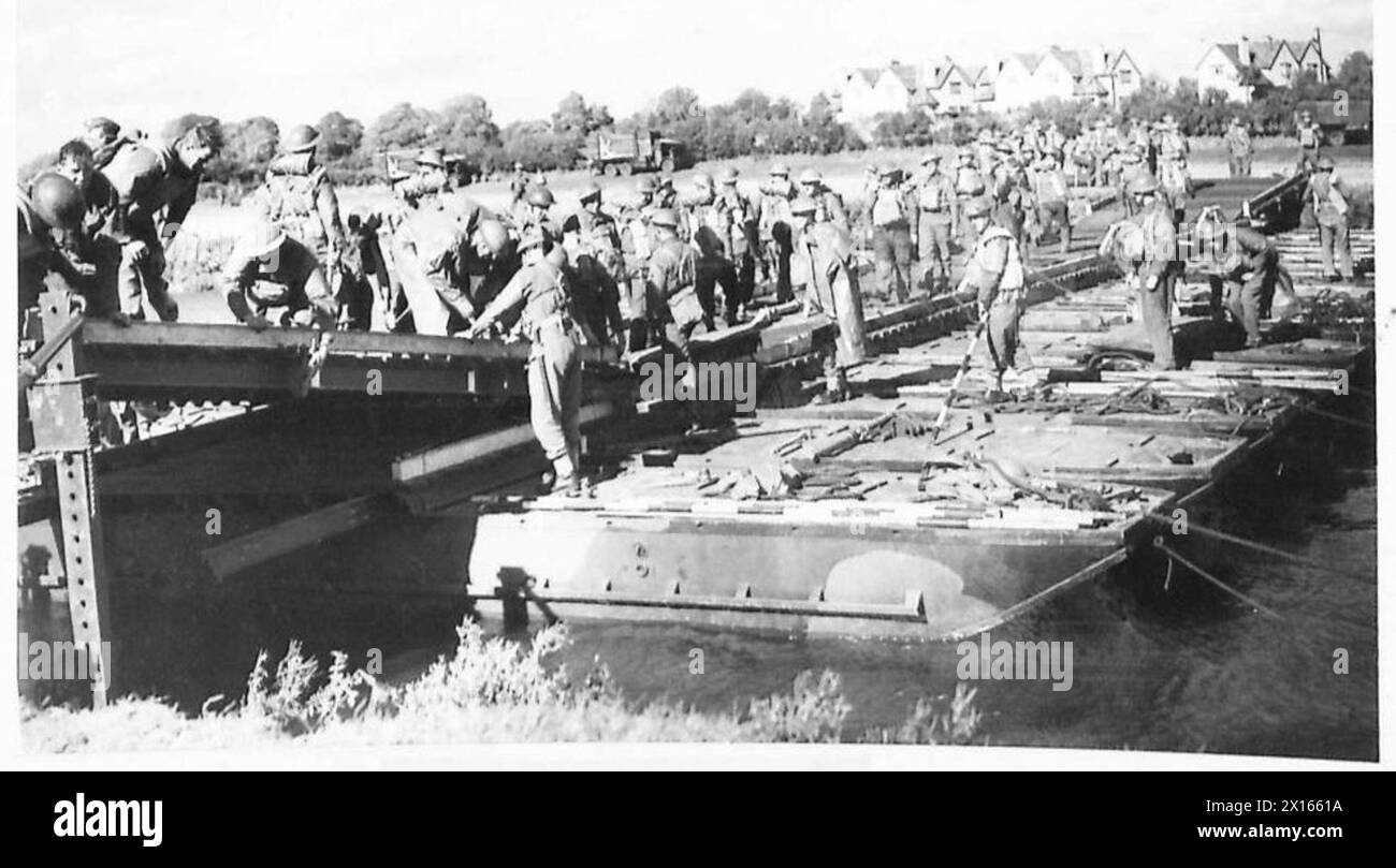 THE ARMY'S BRIDGE BUILDERS - Putting the final touches to the pontoon ...