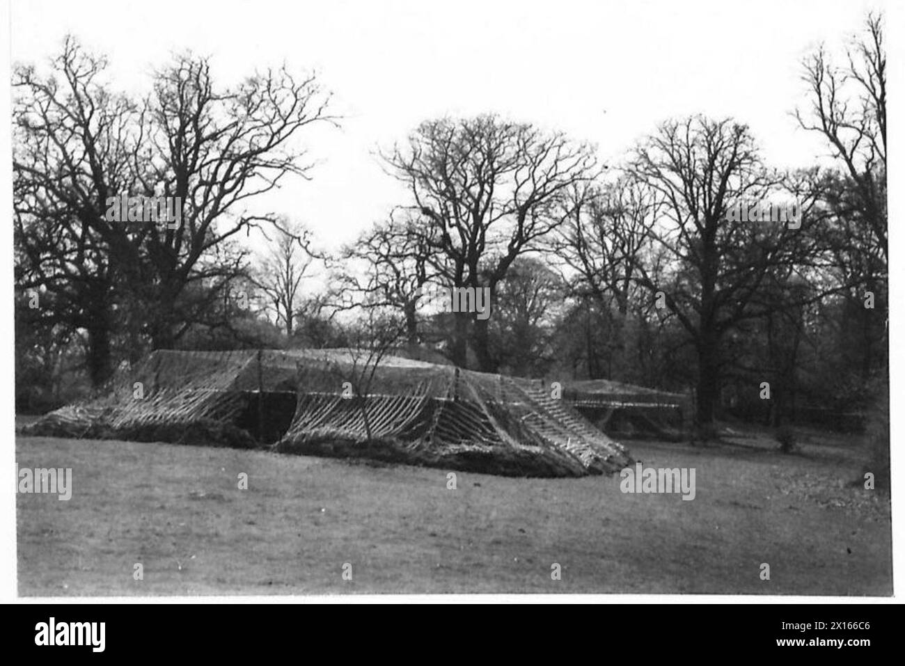 A camouflaged British Army R.A.S.C. petrol dump stores fuel in four ...