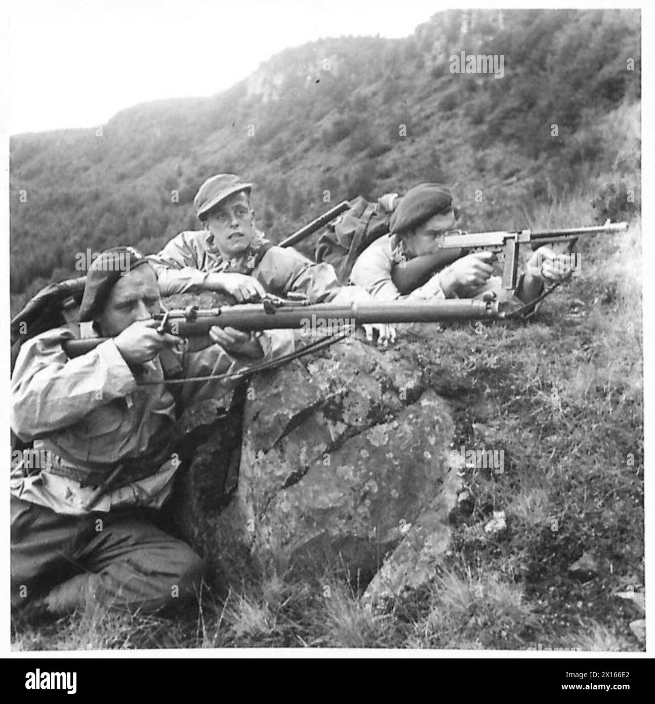 THE GREEN DEVILS - First two men give covering fire to the rest. Centre ...