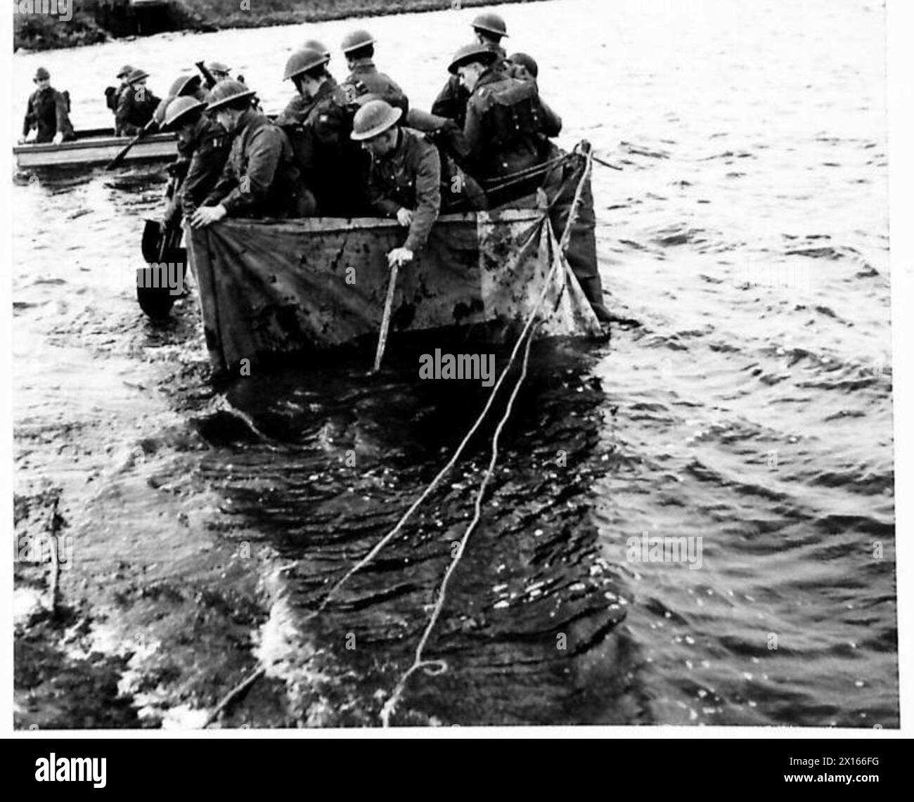 Troops are transported across a lake on an improvised raft carrying ...