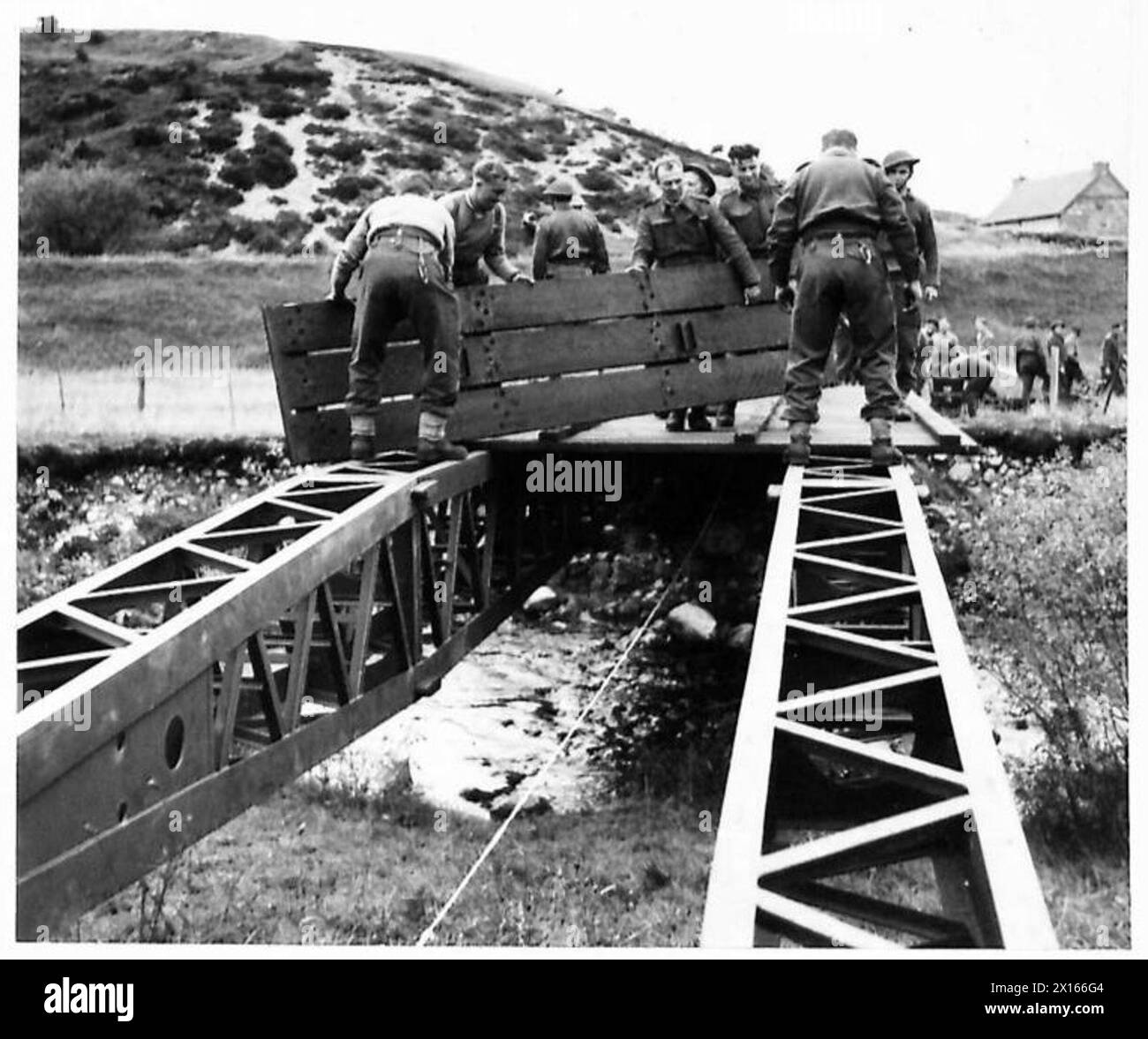 PORTABLE BRIDGE CONSTRUCTION - Royal Engineers lay wooden boards across ...
