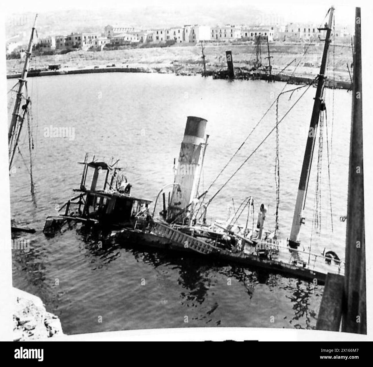 INVASION OF ITALY - Two sunken enemy ships in the harbour at Reggio ...