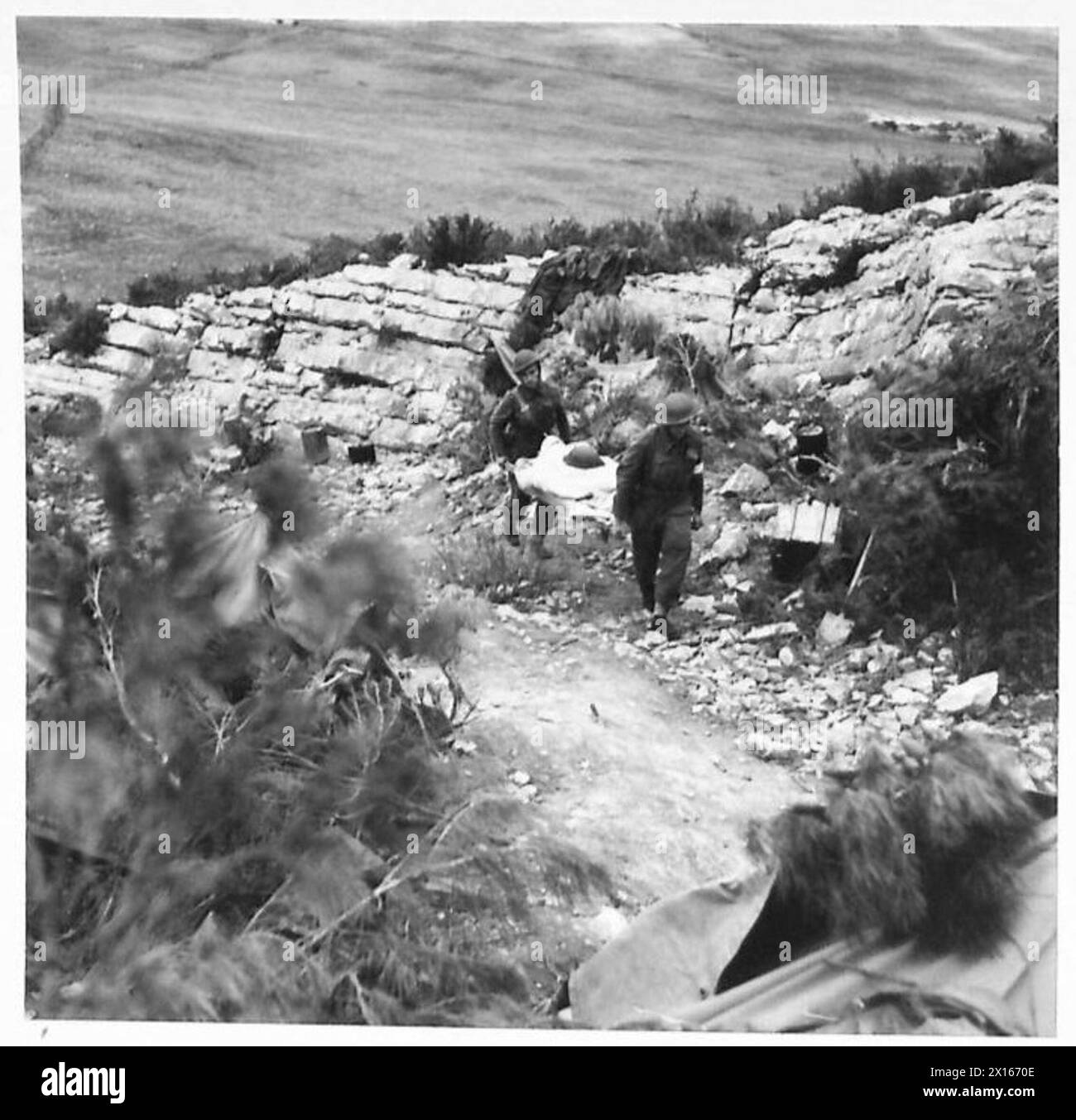 FIRST AID IN THE FIELD NORTH AFRICA - Stretcher bearers bring in a ...