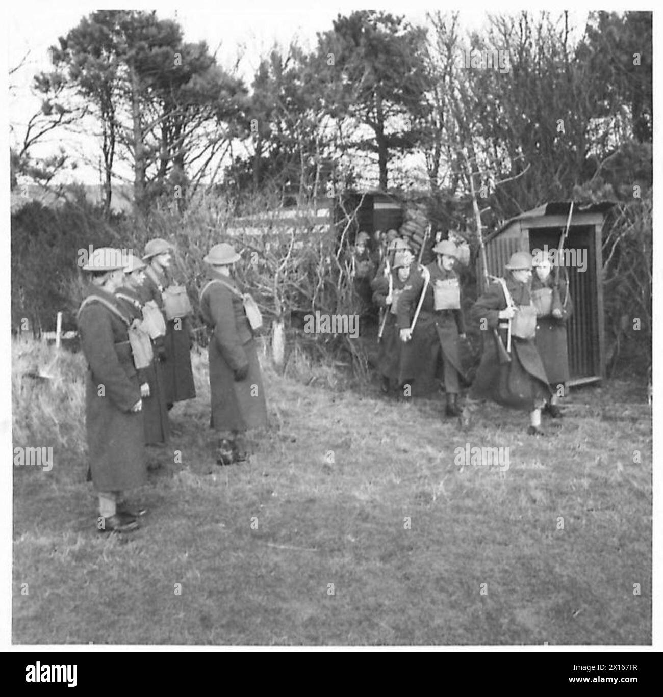 A Home Guard detachment prepares to go out on patrol, training for ...
