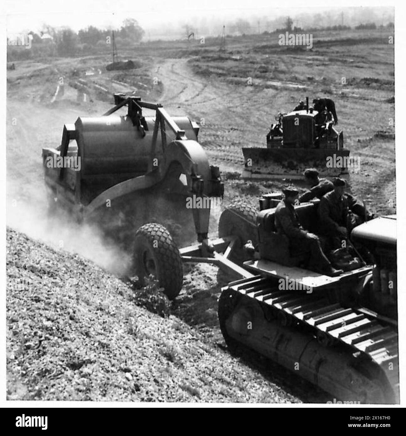 At the Army Motor Tractor School, a scraper is used to rapidly level ...