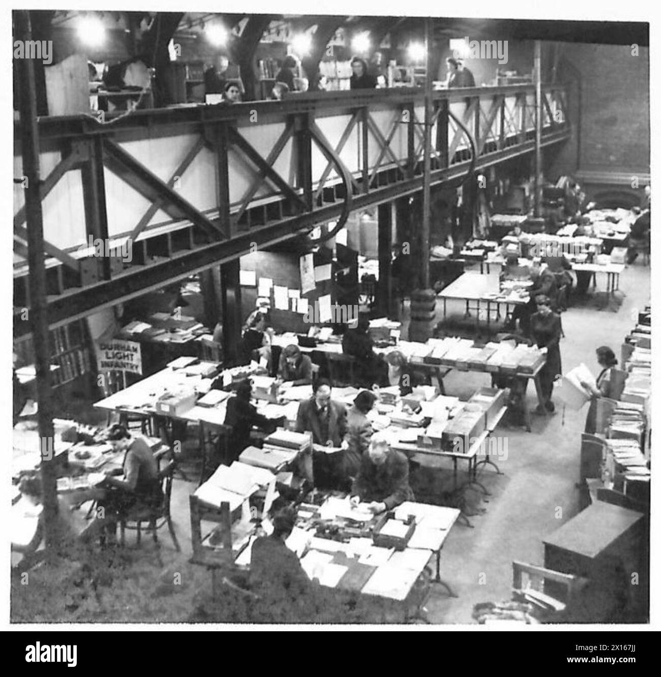 A large army records office, converted from a drill hall, with civilian ...