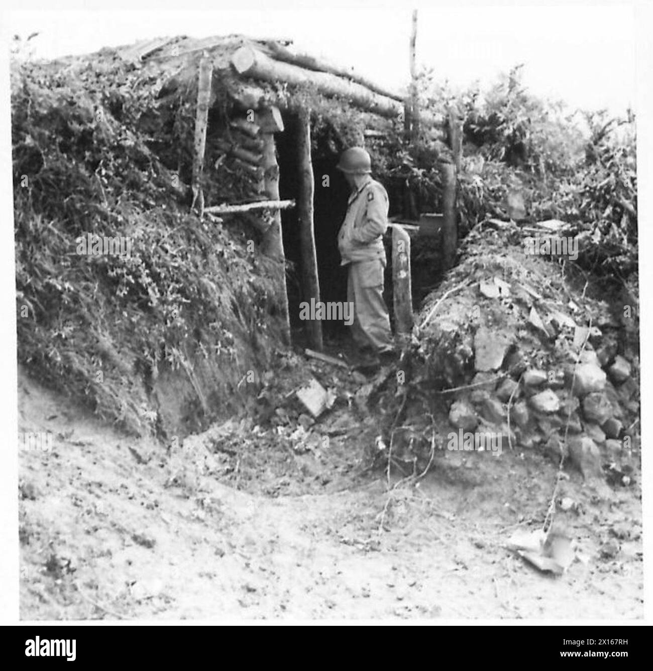 FIFTH ARMY : VARIOUS - An American soldier examines a strong German ...
