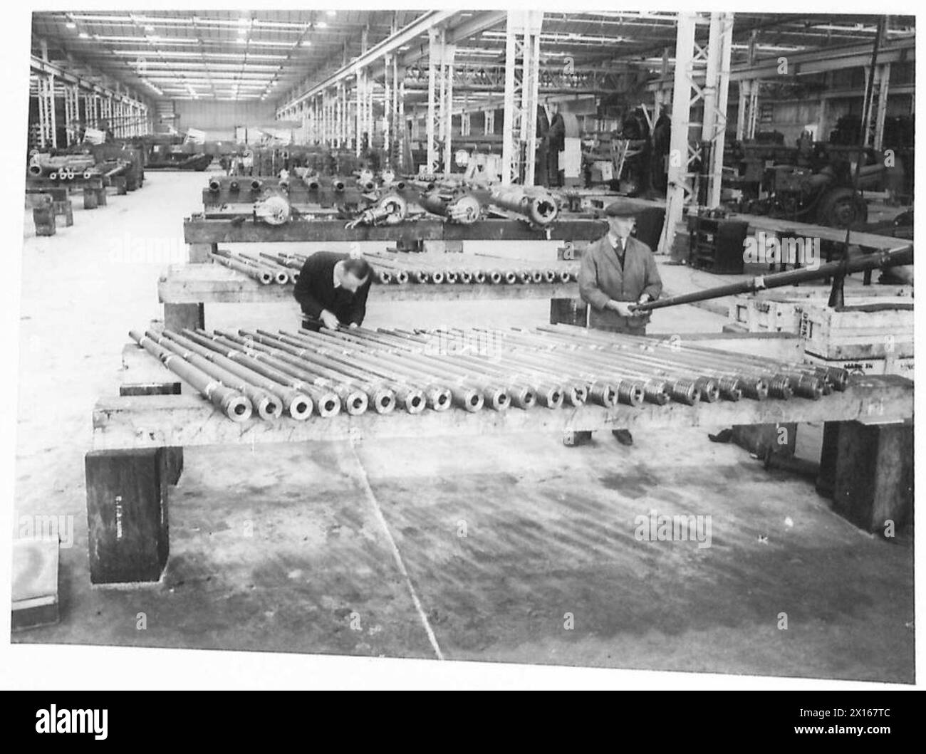 37mm gun barrels supplied under American Lend-Lease are stored and ...