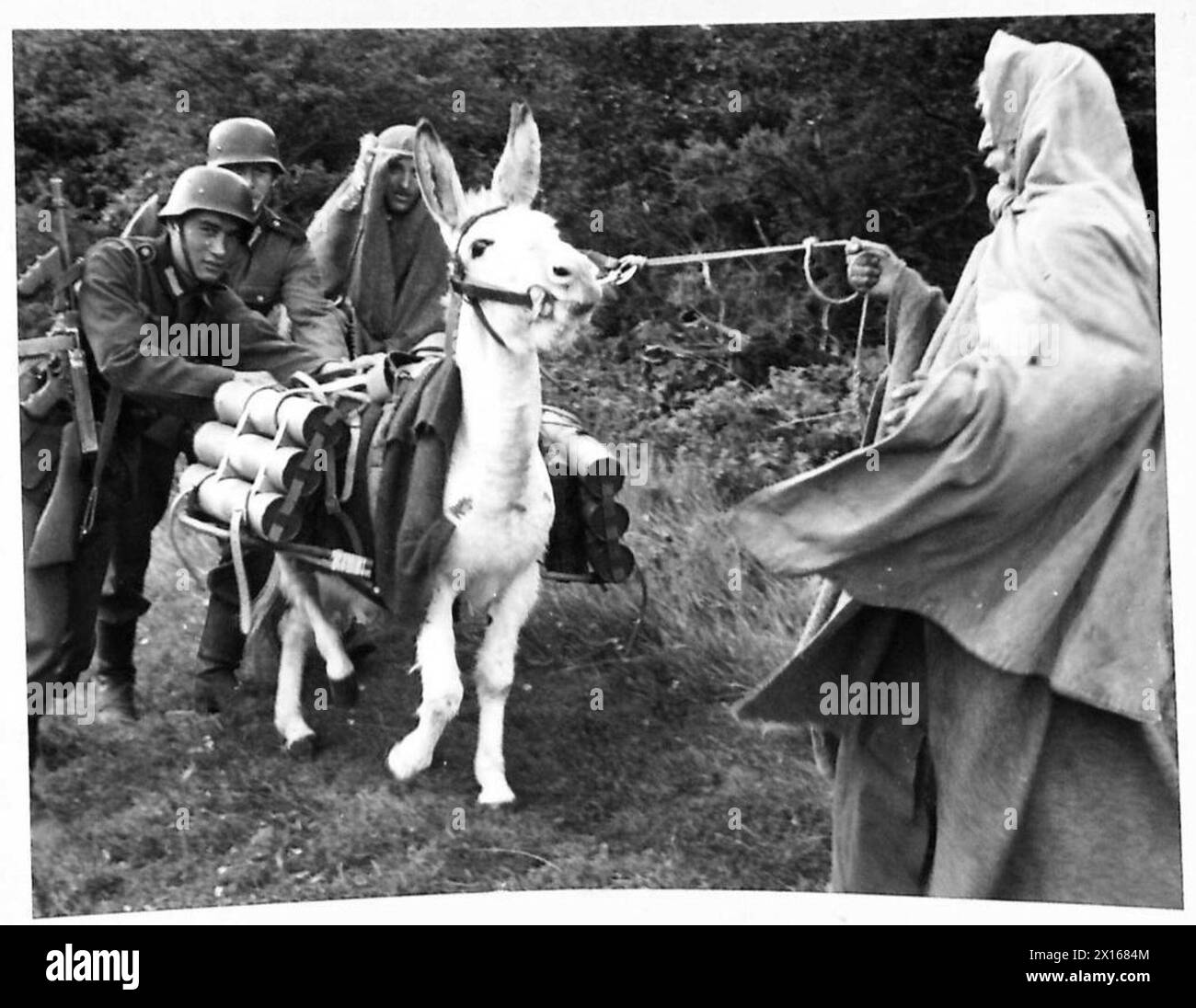 Troops demonstrate German weapons and tactics, using local transport ...