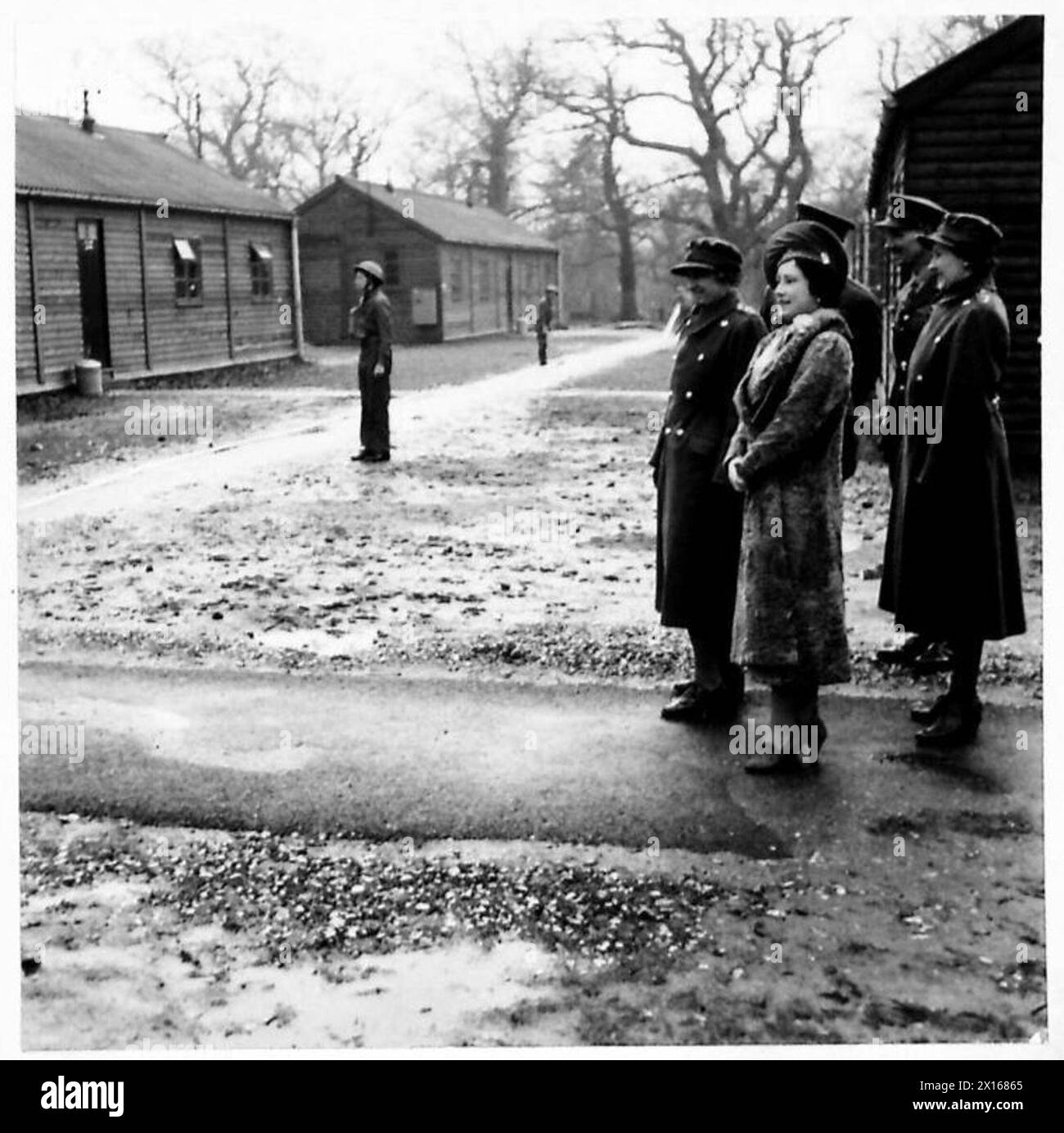 The Queen observes an Auxiliary Territorial Service fire fighting squad ...