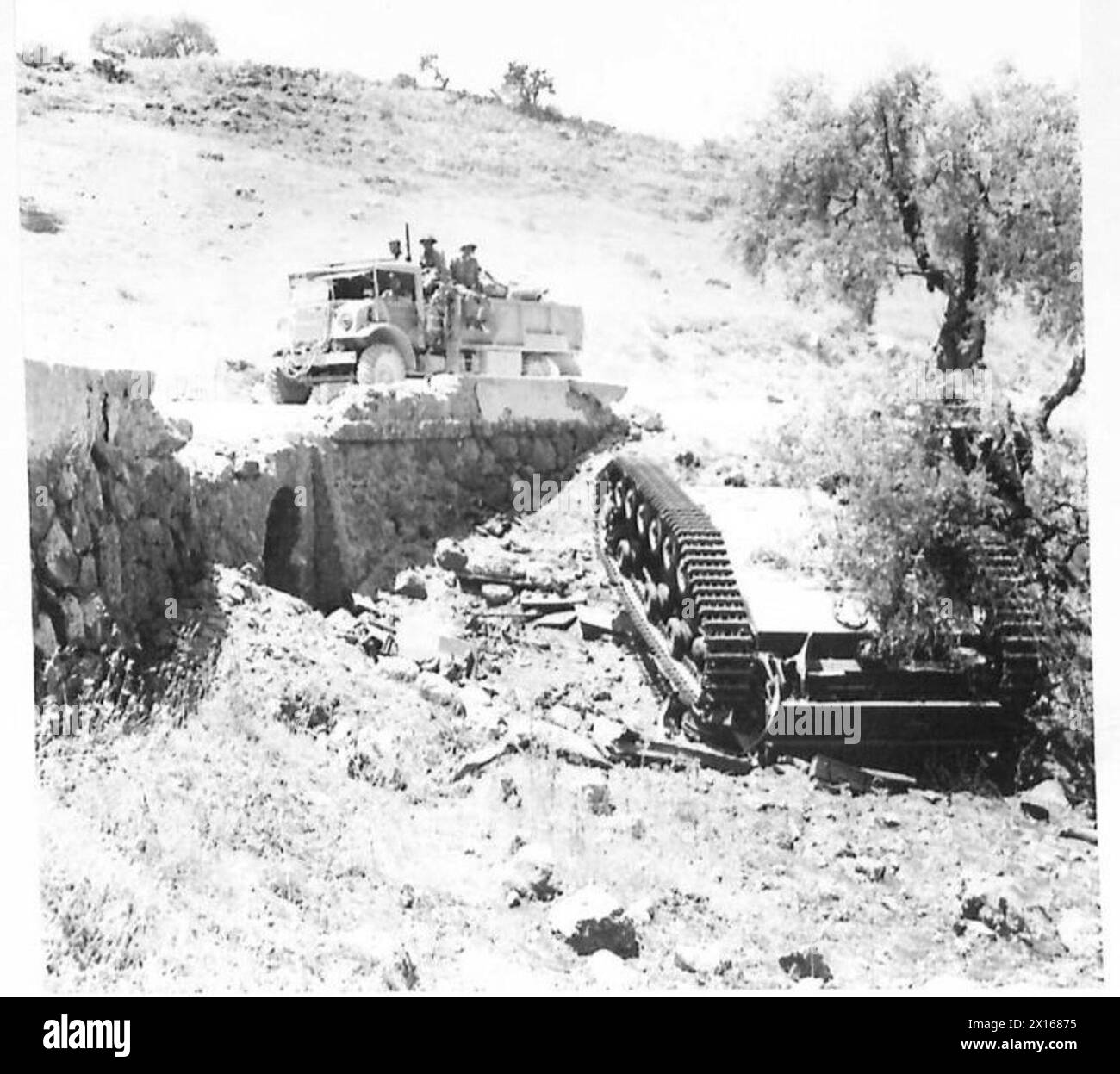 INVASION OF SICILY - British transport passing a German knocked out Mk ...