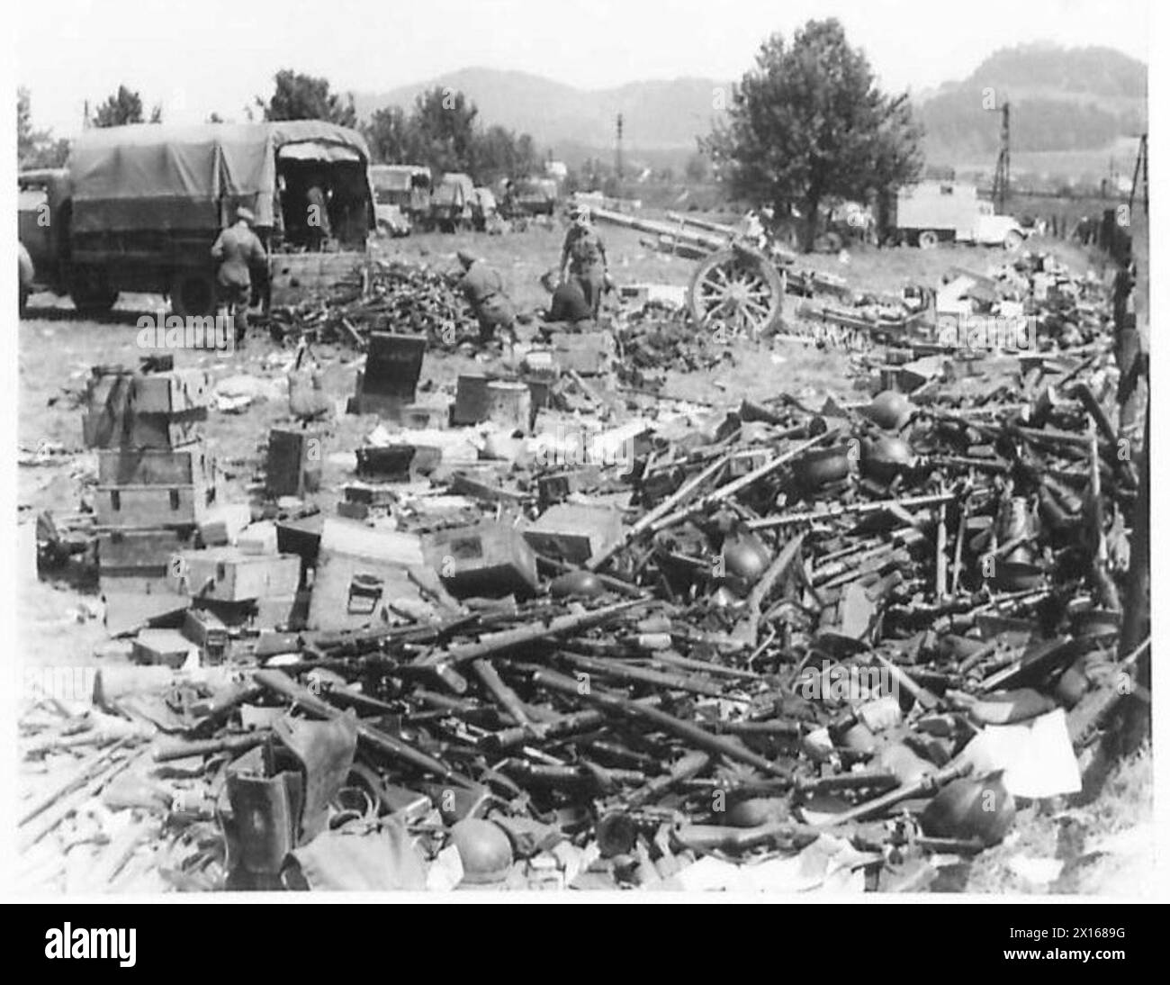As German divisions surrender, rifles and equipment accumulate at the ...