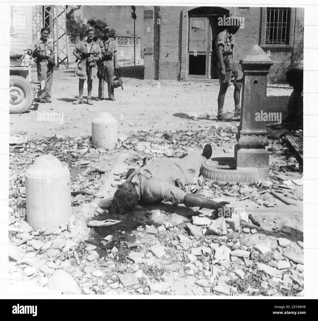 A deceased German soldier is seen unburied in Pesaro during British ...