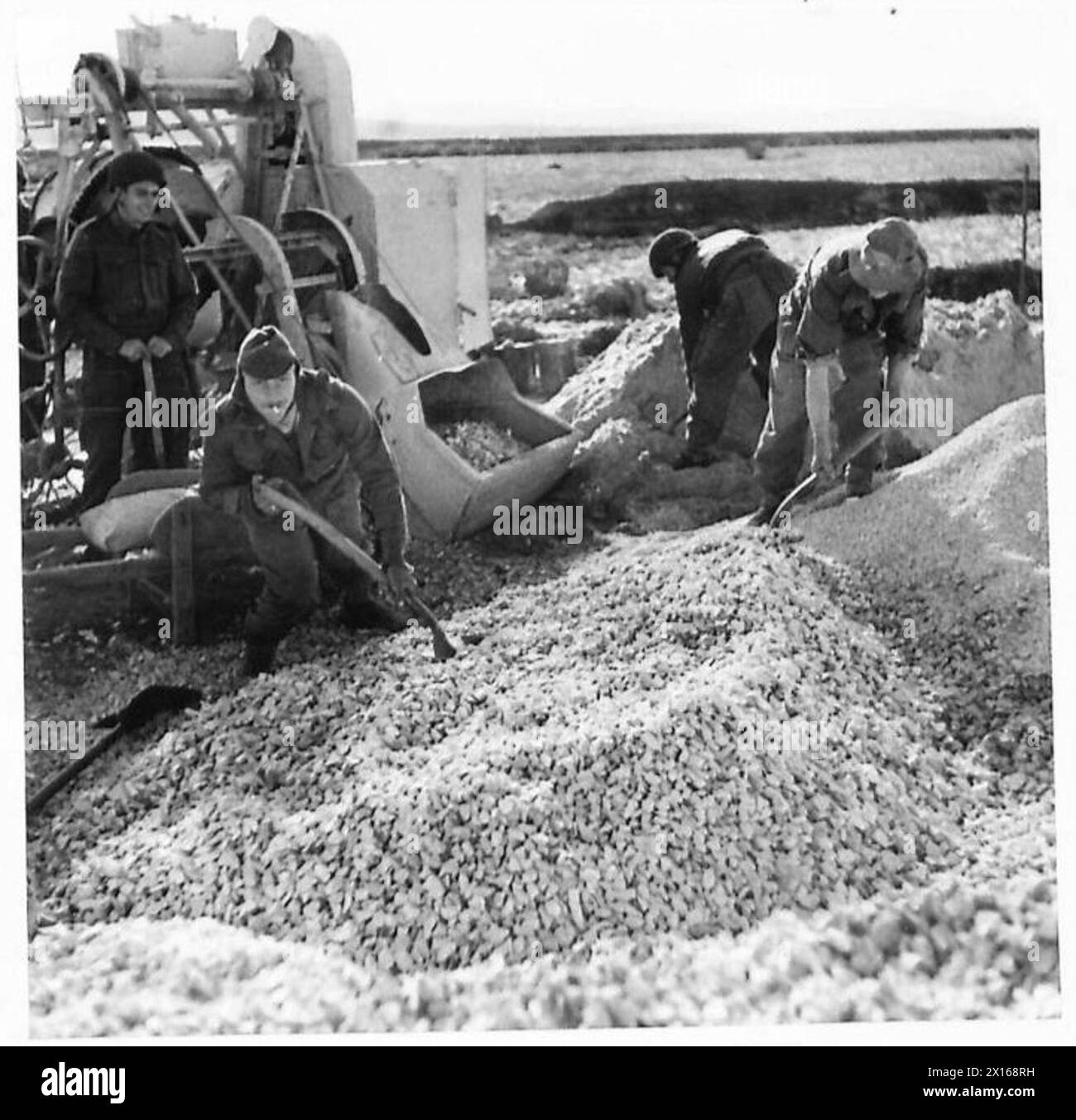 1ST PARACHUTE SQUADRON TAKES OVER - At work on the concrete mixer, F ...