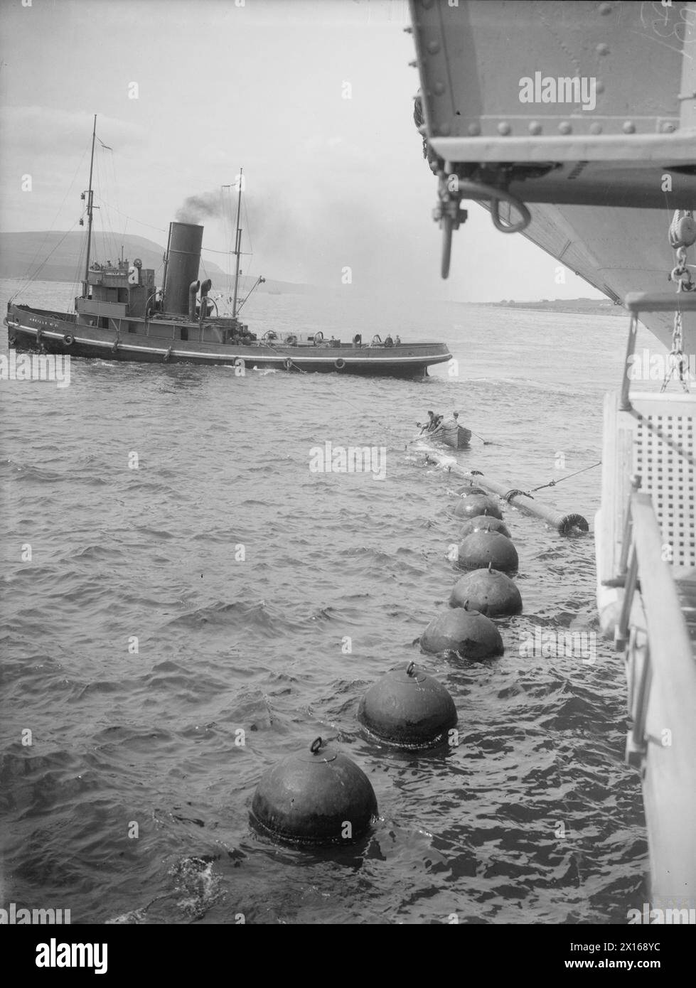 BOOM DEFENCE OF SCAPA FLOW. 19 JUNE 1942. - The Boom defence tug HMS ...