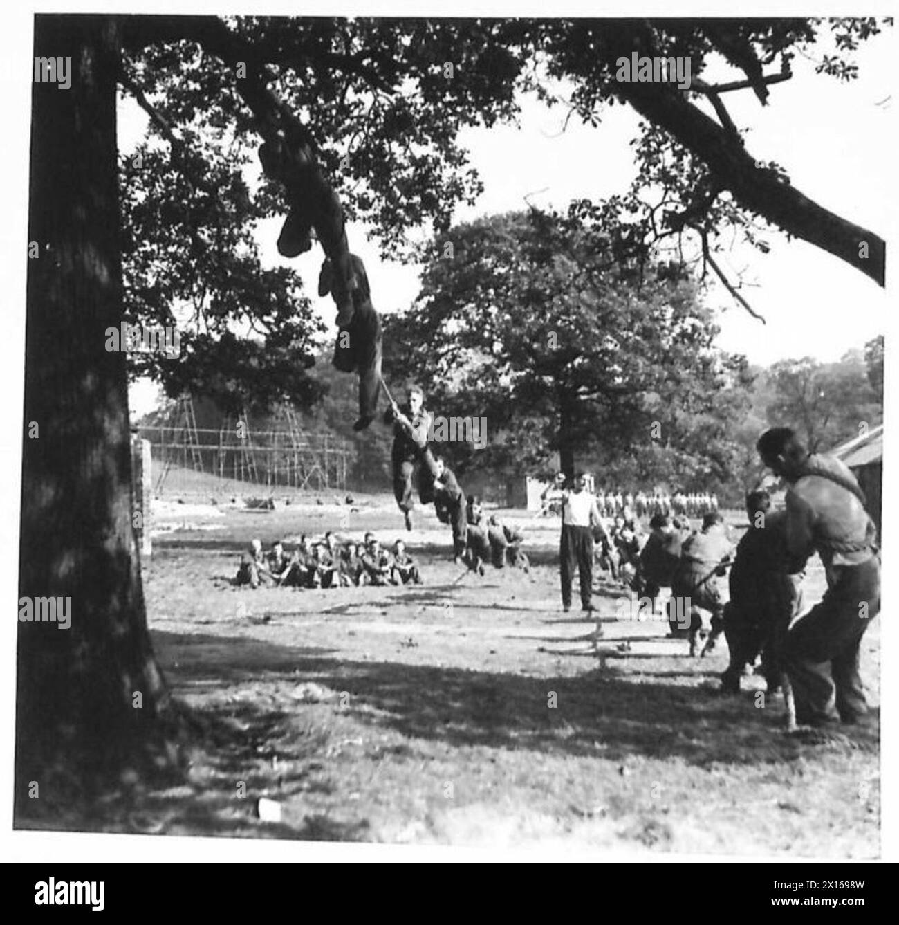 At the Parachute Training Depot and School, an instructor coaches a tug ...