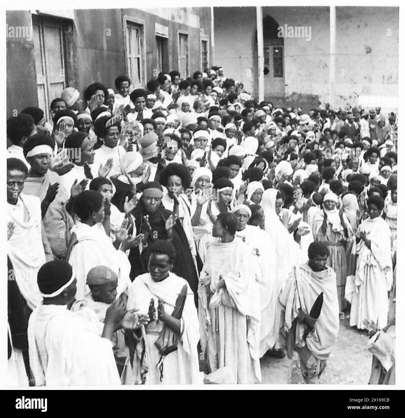 HAILLE SALASSIE ENTERS ADDIS ABABA - A section of the natives listening ...