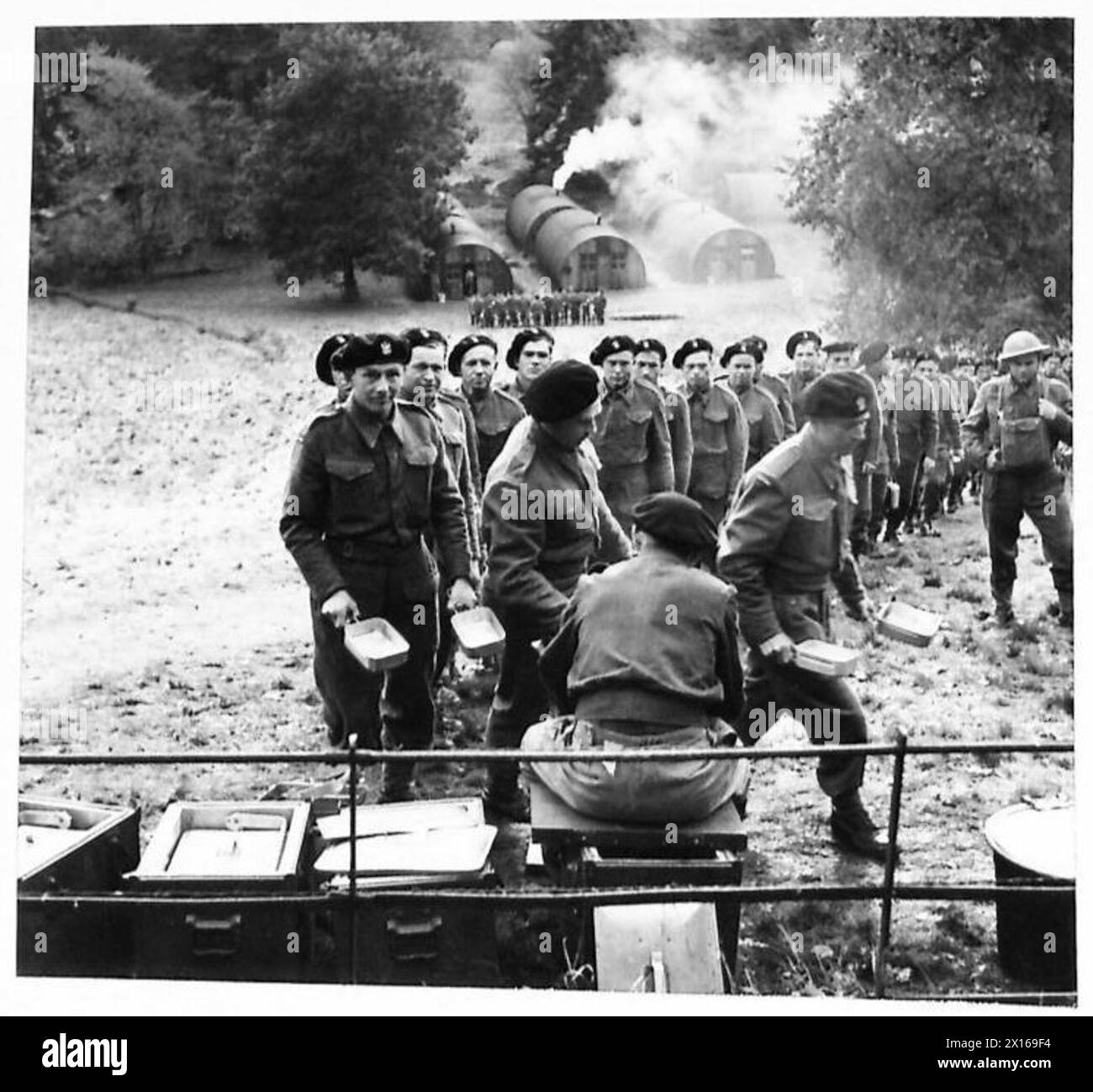 Polish volunteers from South America queue for food rations at their ...
