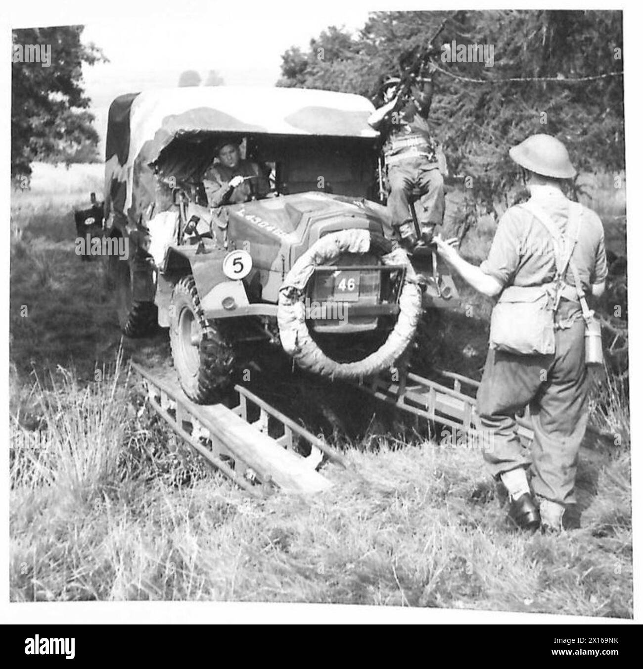 A HANDY BRIDGE - A Portee truck successfully crossing one of the small ...