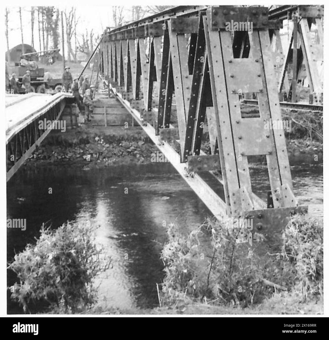 BRIDGE BUILDING - Another view of a section of the bridge being hauled ...