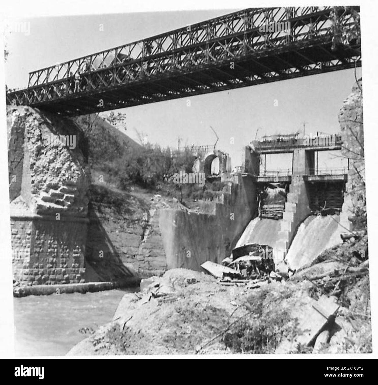 The Liri Dam shows damaged lock gates with a Bailey bridge spanning the ...