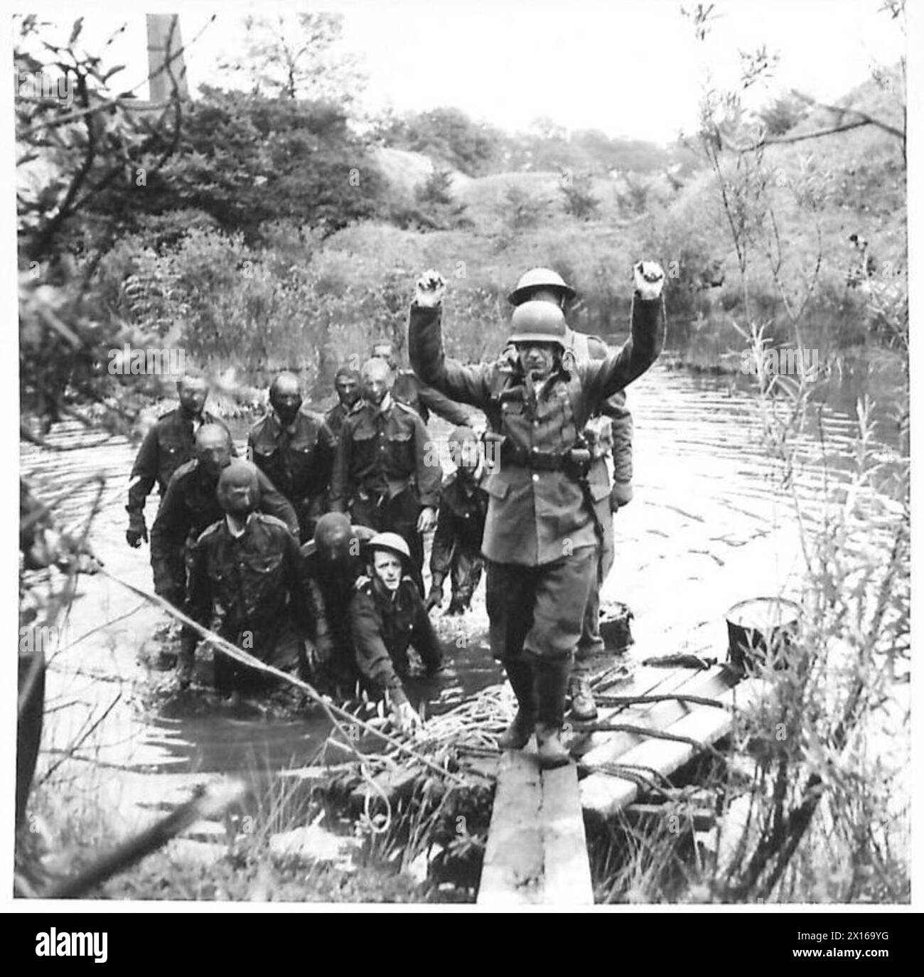 A PLATOON IN ATTACK - A Platoon Commander taking a "prisoner" ashore ...