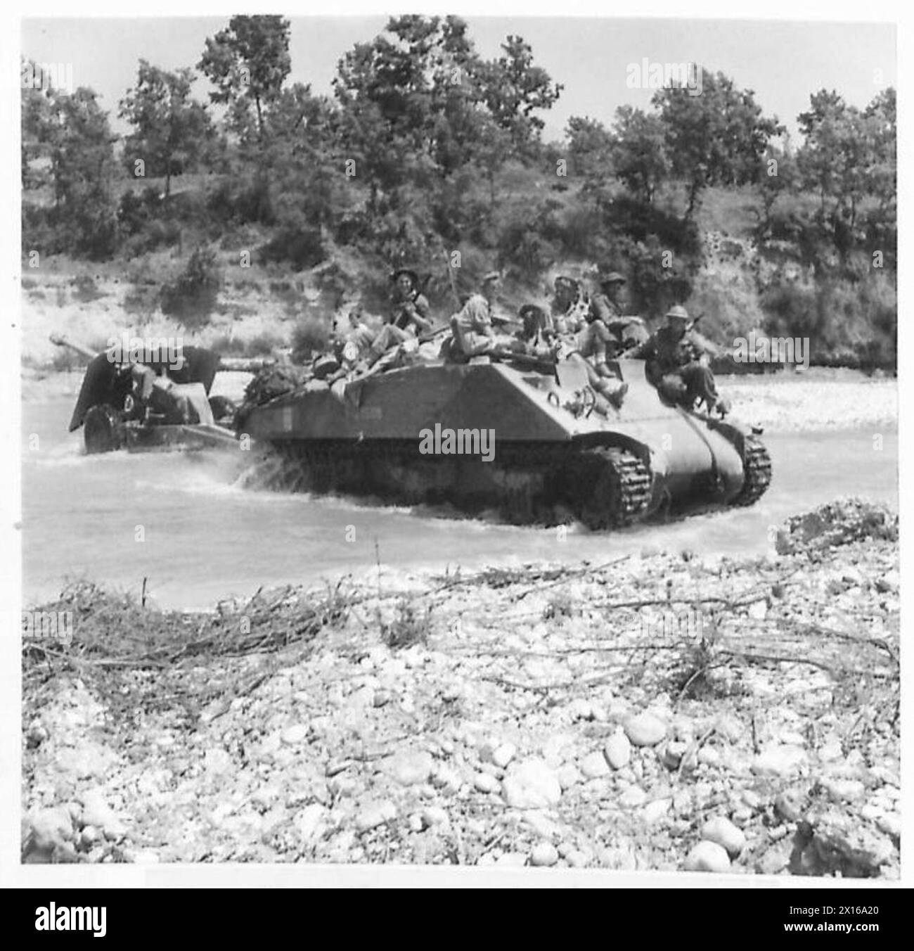 THE BRITISH ARMY IN ITALY 1944 - A Sherman tank towing an anti-tank gun ...