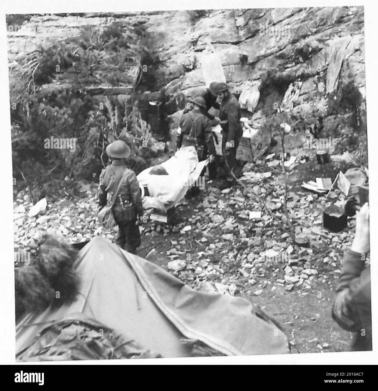 FIRST AID IN THE FIELD NORTH AFRICA - The wounded man arrives at the ...