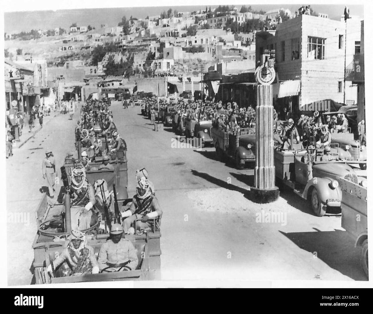 In Transjordan, a parade of cavalry, armoured vehicles, and armoured ...