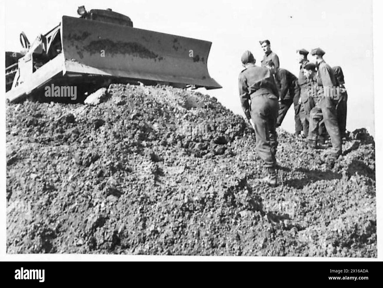 ARMY MOTOR TRACTOR SCHOOL - Men Inspect the bulldozer after the climb ...