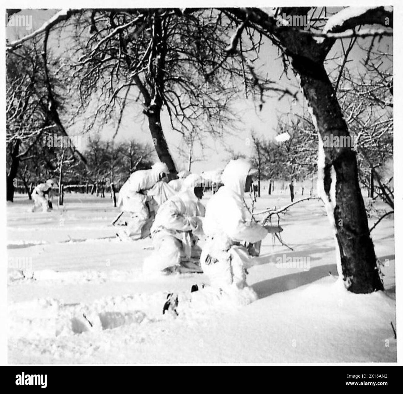 Members of the White Patrol of the British Army remain alert and kneel ...
