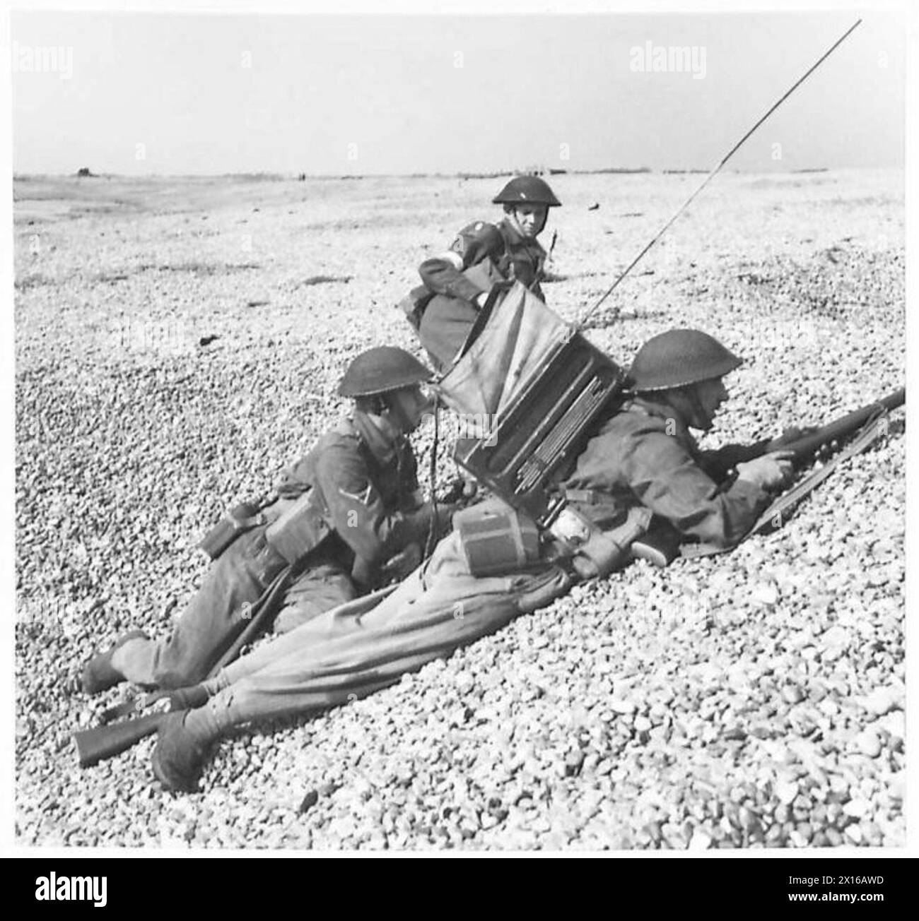 Men of the Battalion Headquarters advance with troops during a combined ...