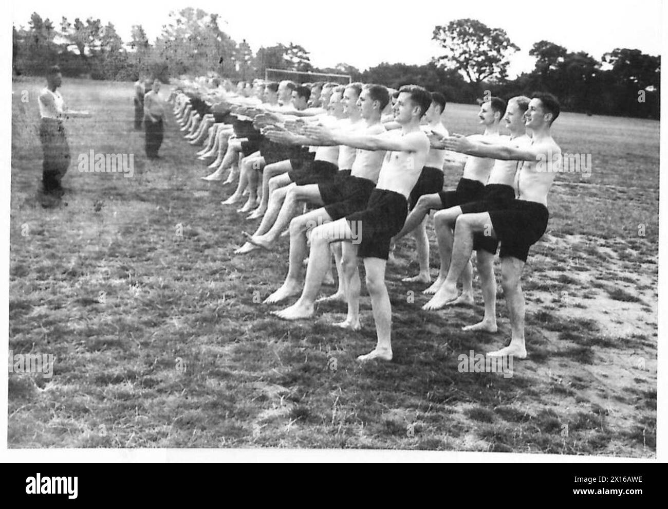 Gunner recruits participate in physical training exercises under the ...