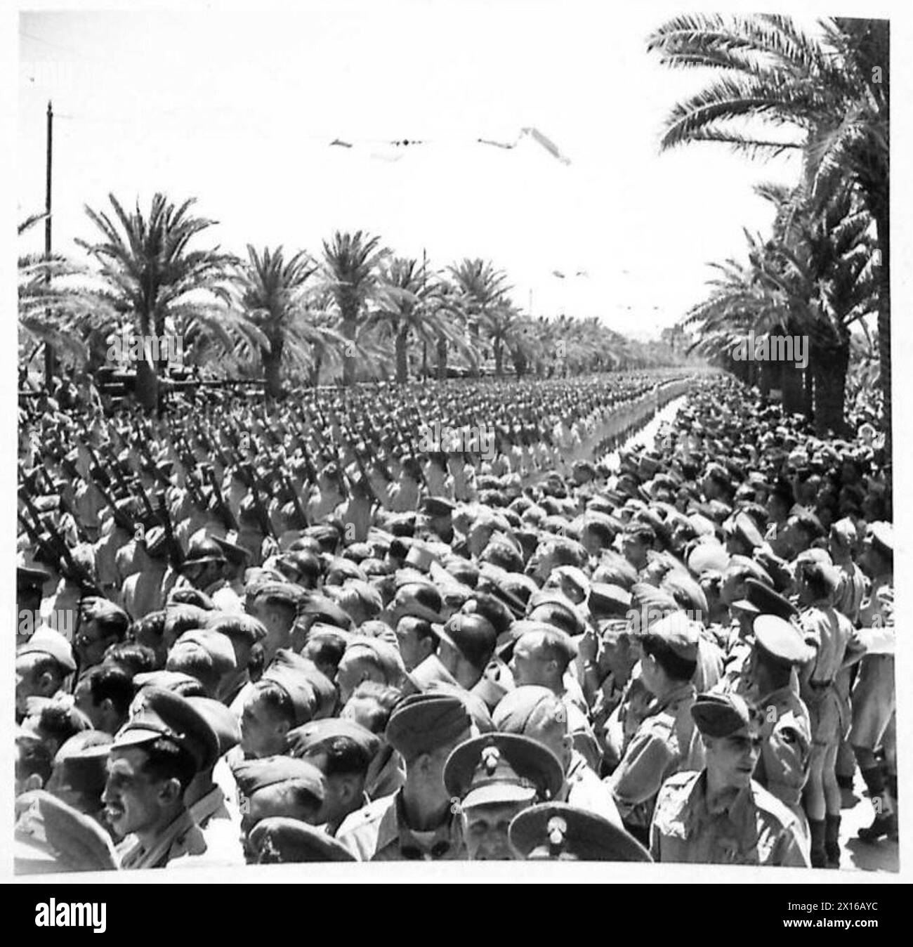 British troops march past a saluting base in Tunis during victory ...