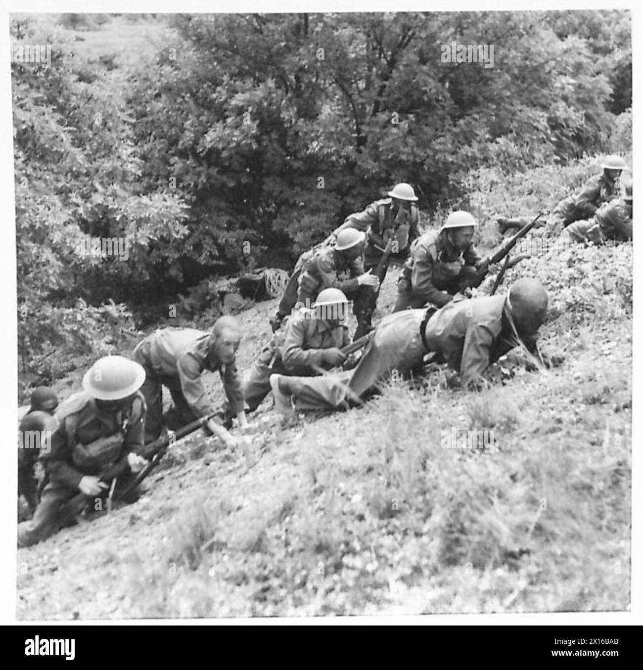 A PLATOON IN ATTACK - A section of the Home Guard platoon prepare to ...