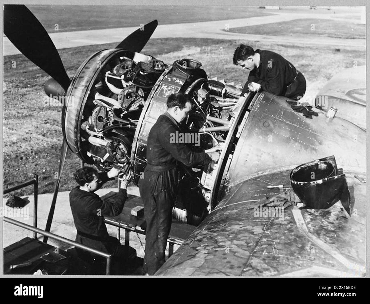 Engine fitters work on a Stirling bomber at an Operational Training ...