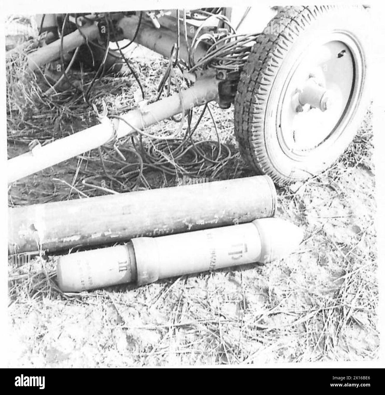 A mortar bomb with carrying case is prepared for use; electrically ...