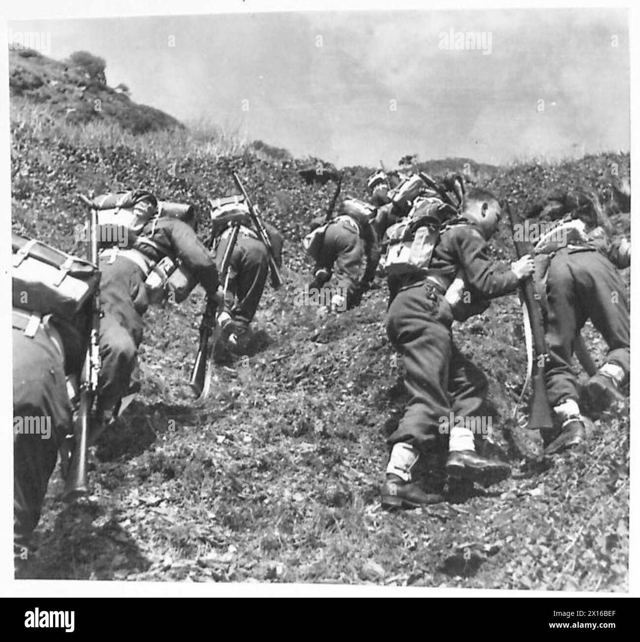 LIVING ON THE COUNTRY - Men racing up a steel hillside carrying full ...