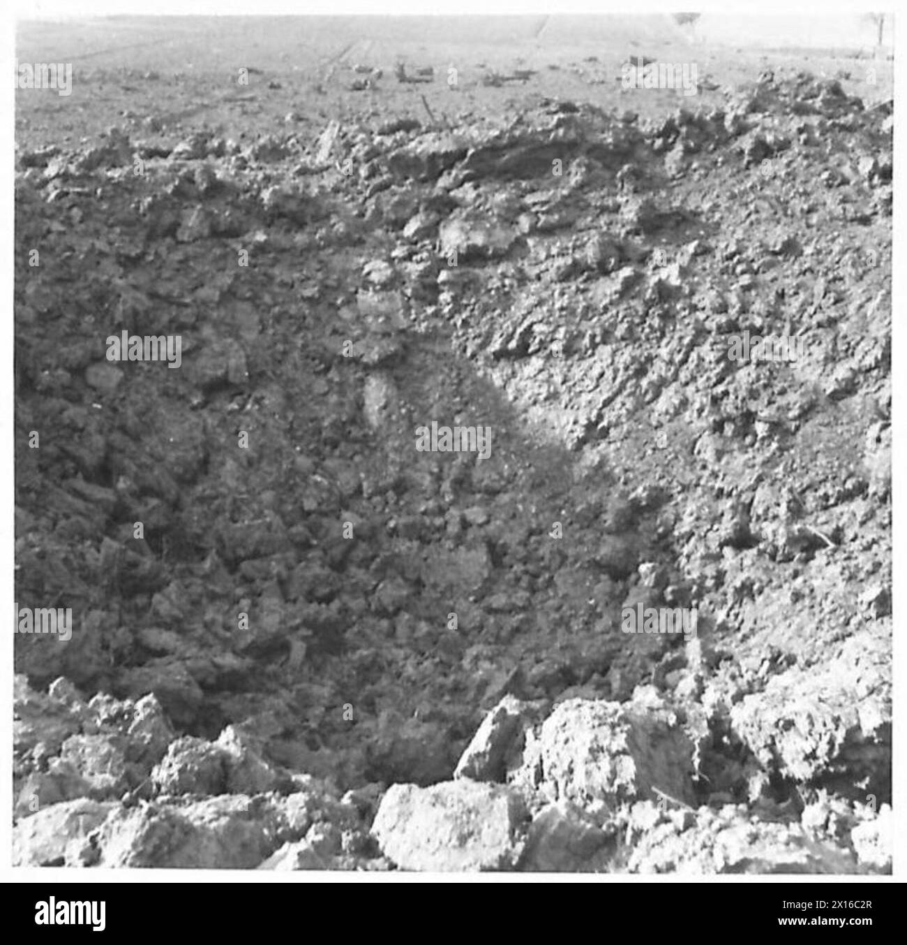 AMMUNITION DUMP EXPLODES - These pictures show the crater and debris ...